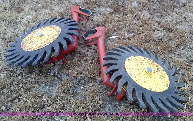 Gathering wheels from New Holland BR780 round baler in Bushton, KS ...