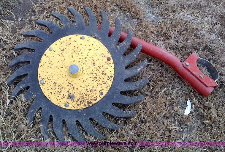 Gathering wheels from New Holland BR780 round baler in Bushton, KS ...