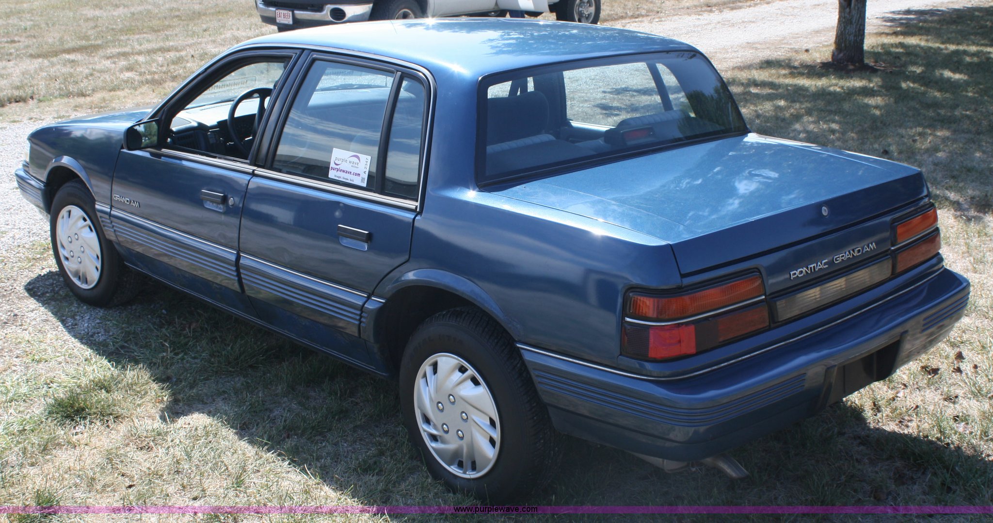 1990 Pontiac Grand Am LE in Paola, KS | Item A2347 sold | Purple Wave