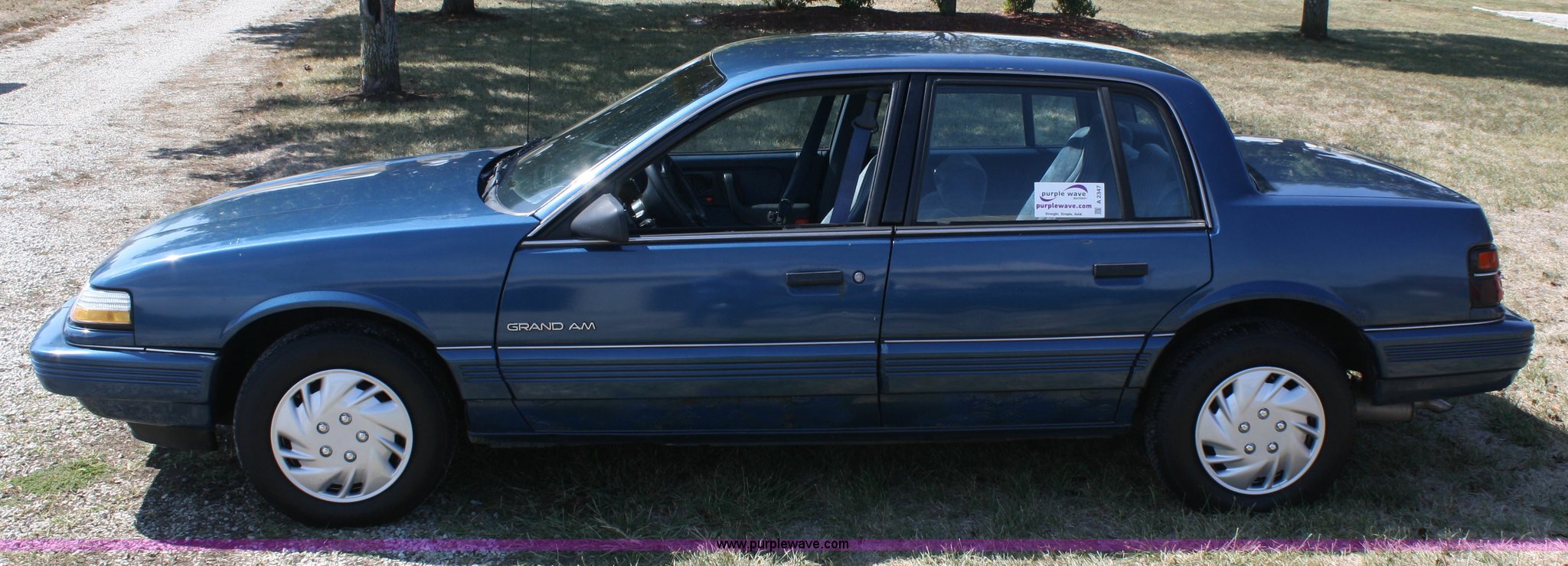 1990 Pontiac Grand Am LE in Paola, KS | Item A2347 sold | Purple Wave
