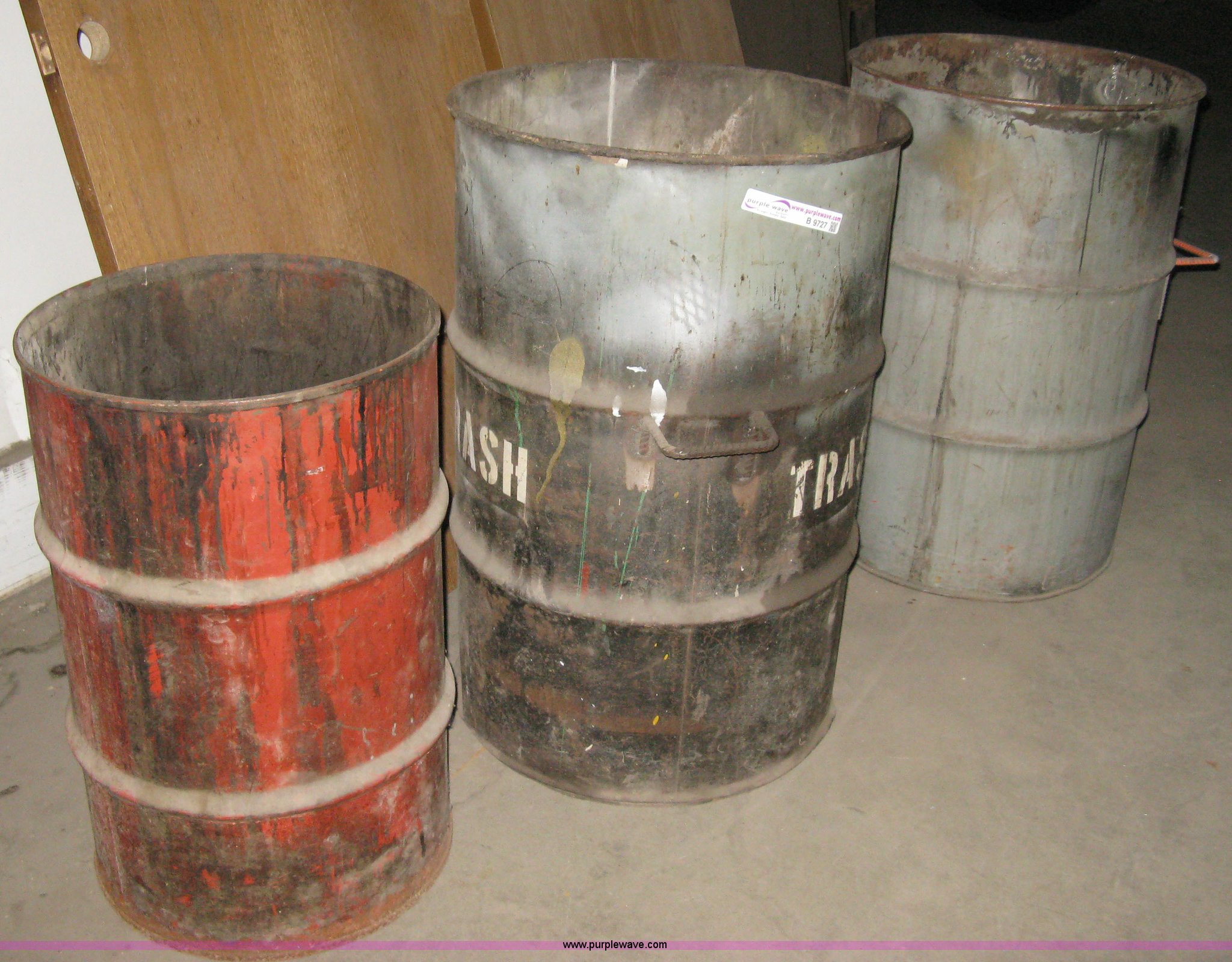 (3) assorted steel trash drums in Derby, KS | Item B9727 sold | Purple Wave