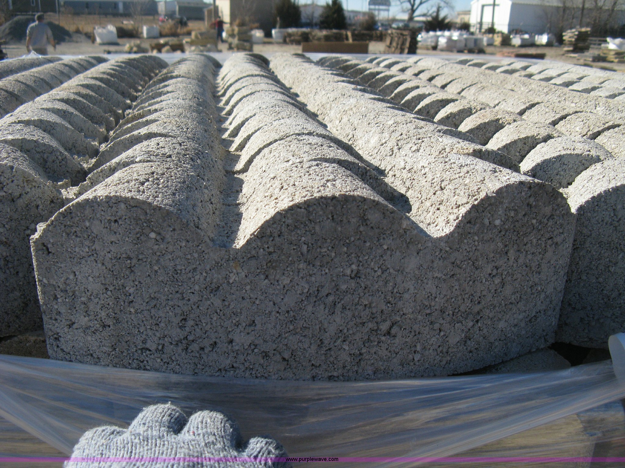 Over 800 pieces of gray curved concrete scallop edging on 2 pallets in ...