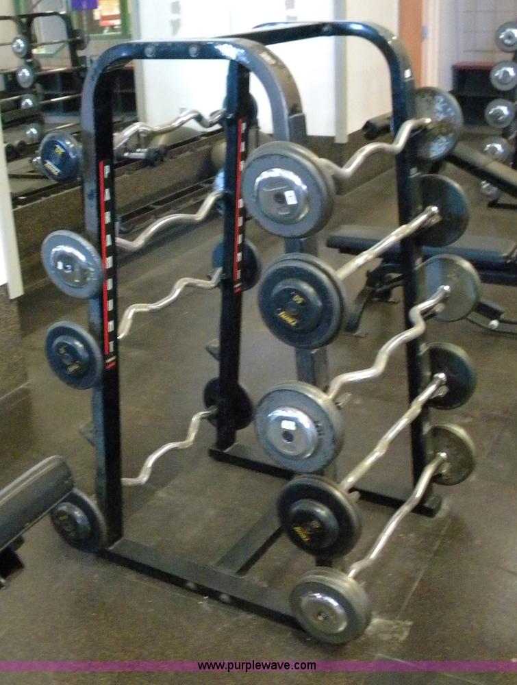 EZ curl bars with rack in Manhattan, KS | Item B1908 sold | Purple Wave