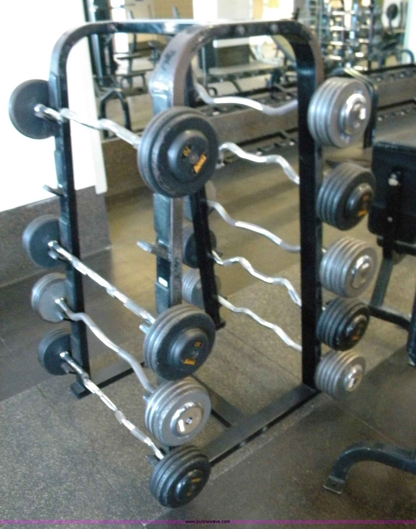 EZ curl bars with rack in Manhattan, KS | Item B1908 sold | Purple Wave