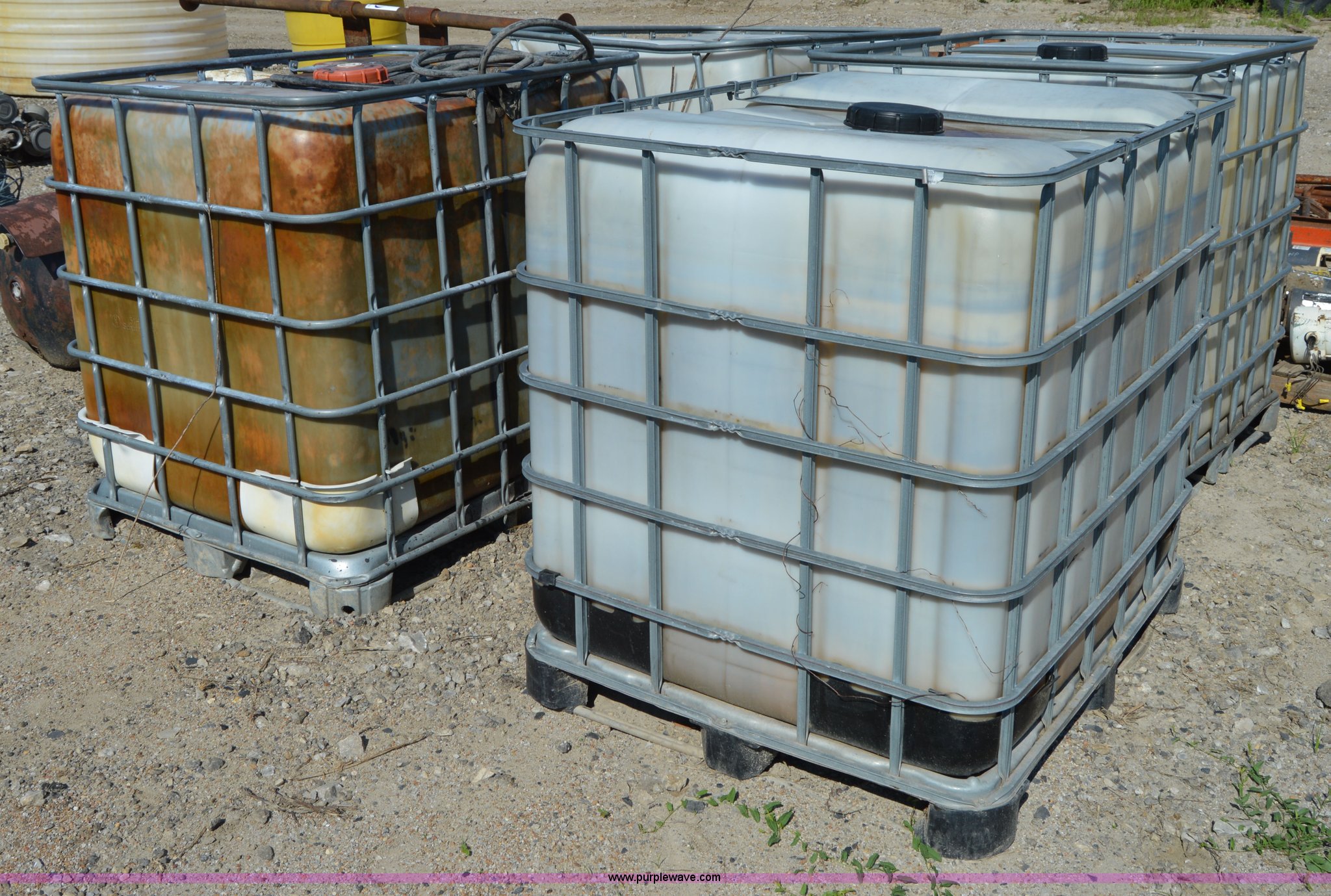 (4) 250 gallon oil totes in Odessa, MO | Item I4666 sold | Purple Wave