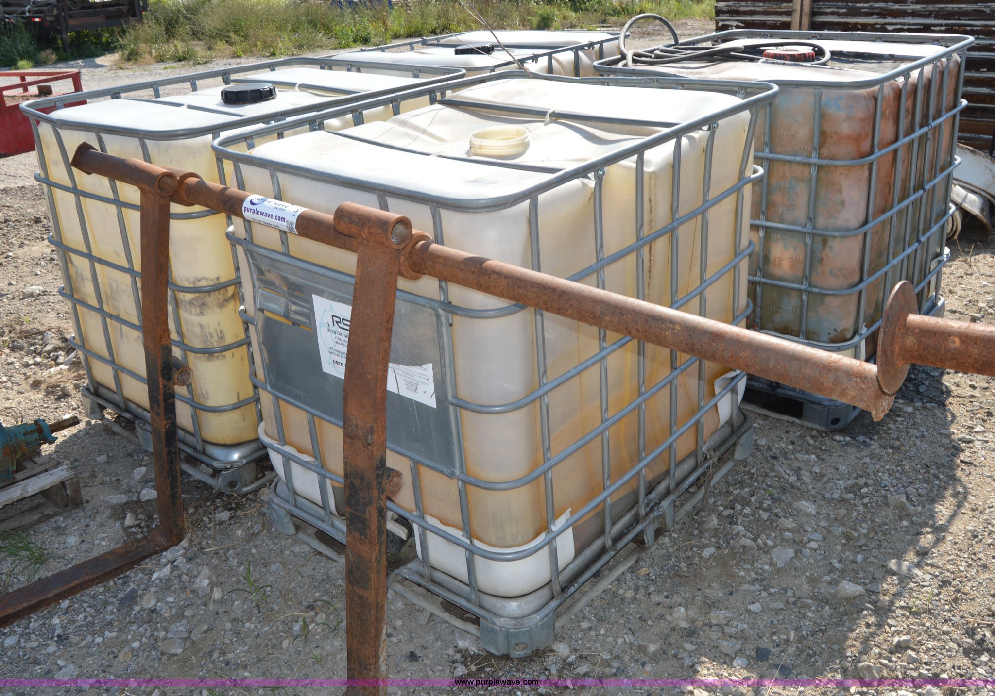 (4) 250 gallon oil totes in Odessa, MO | Item I4666 sold | Purple Wave