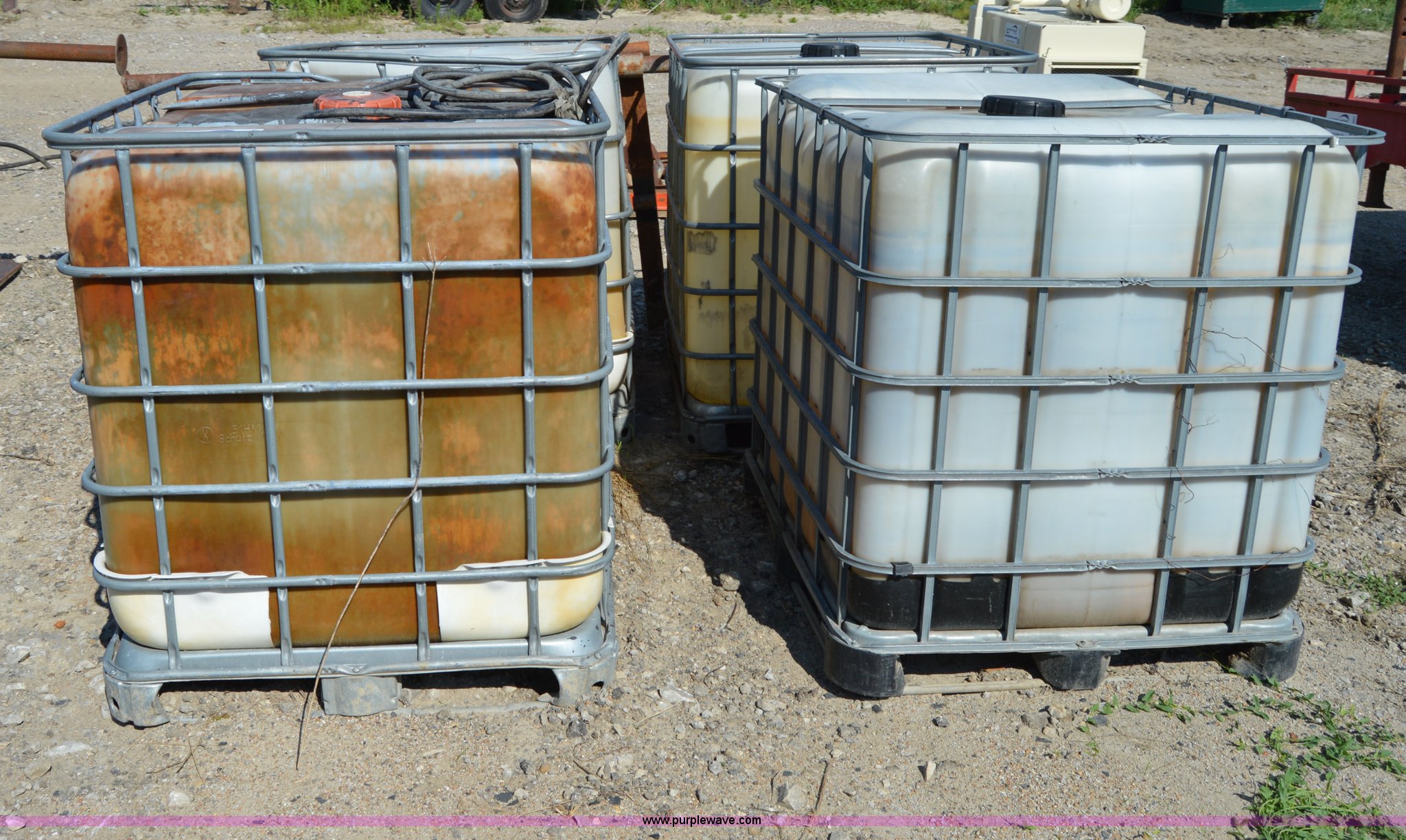 (4) 250 gallon oil totes in Odessa, MO | Item I4666 sold | Purple Wave