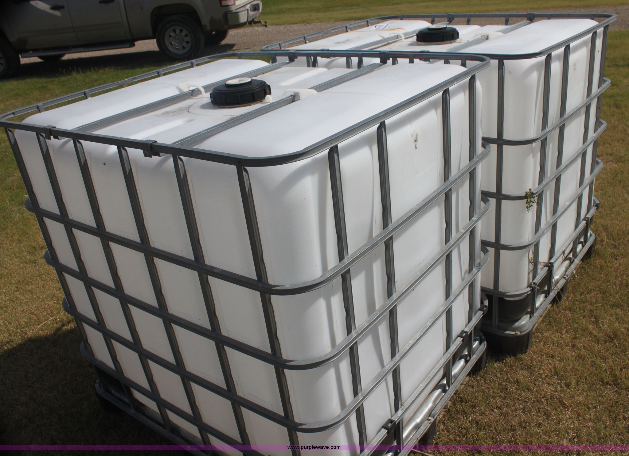 (2) 275 gallon plastic totes in Leon, KS | Item F3279 sold | Purple Wave