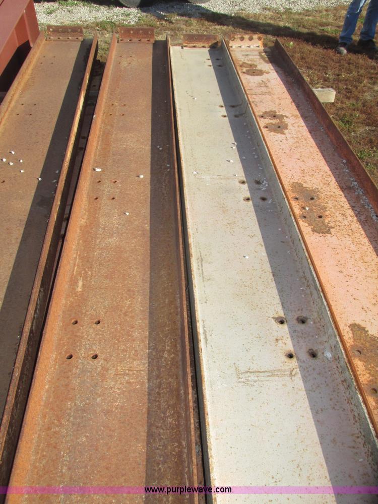 (8) red iron I-beams in Falls City, NE | Item G9896 sold | Purple Wave