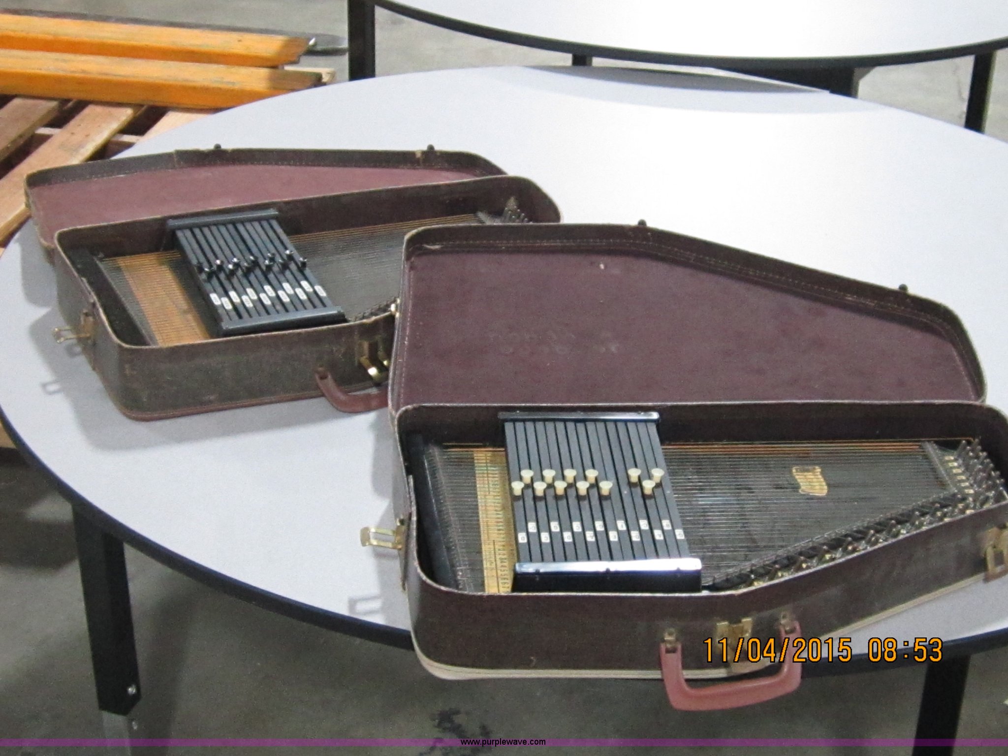 (2) auto harps with cases in Lawrence , KS | Item E1088 sold | Purple Wave