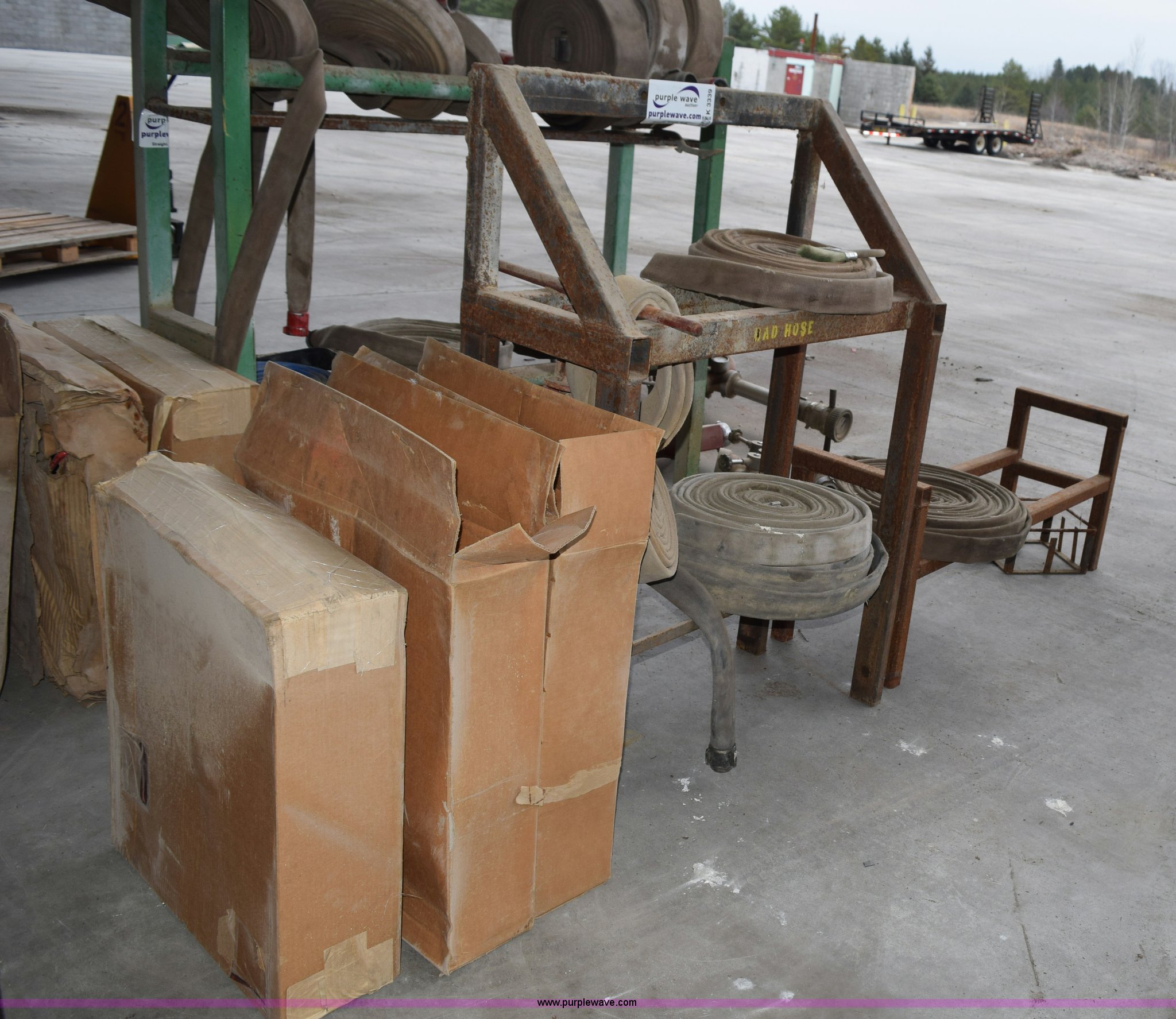 Assorted fire hose and racks in Cook, MN | Item K3339 sold | Purple Wave