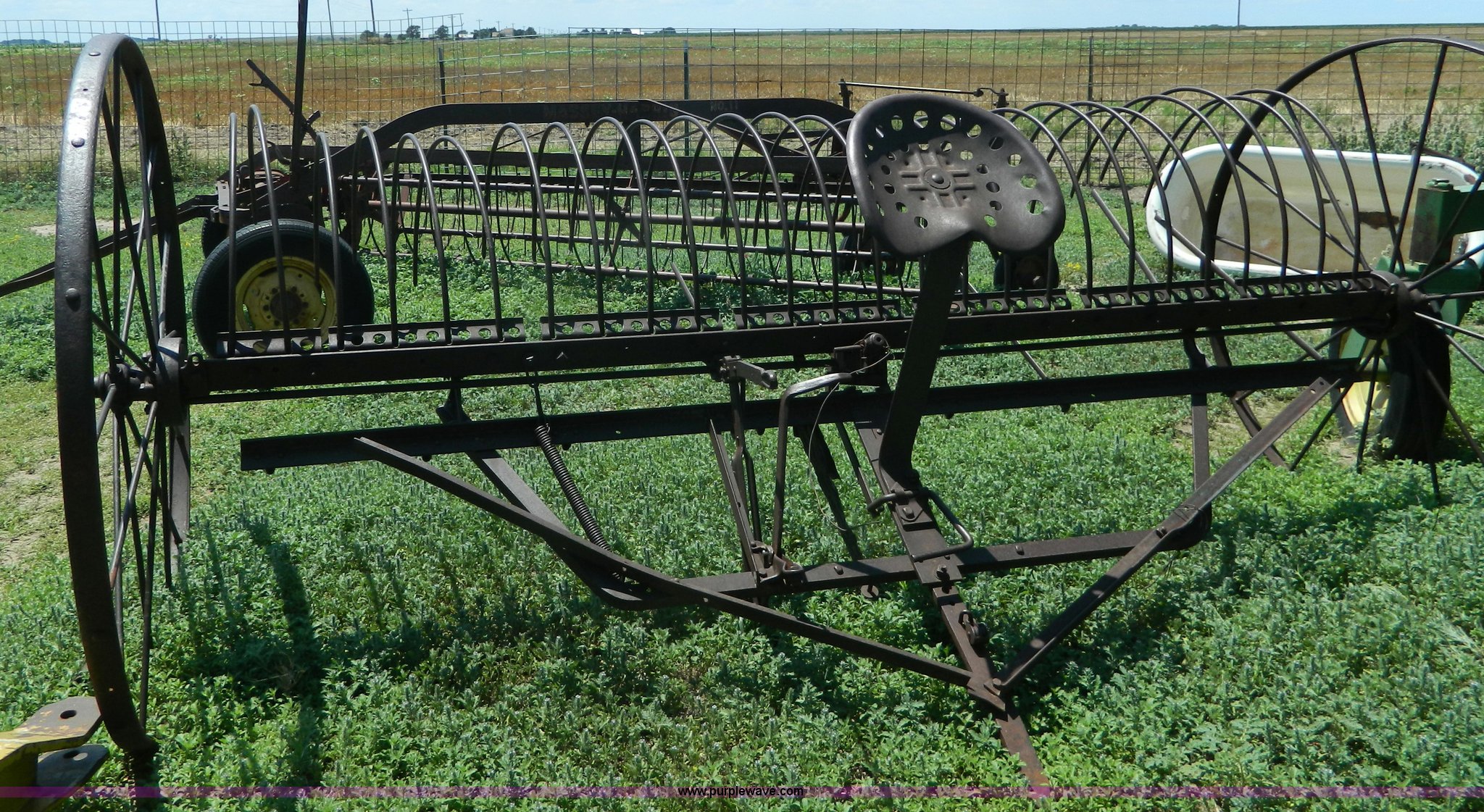 Sulky buck rake in Great Bend, KS | Item J8862 sold | Purple Wave