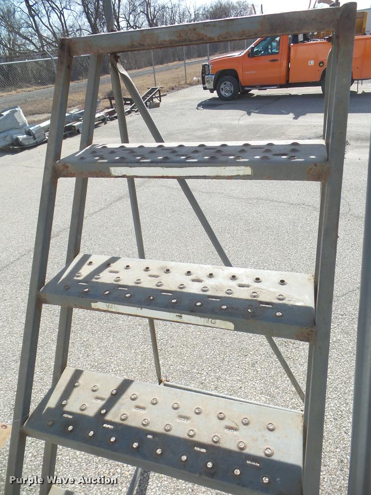 (2) steel ladders in Salina, KS | Item DA7708 sold | Purple Wave