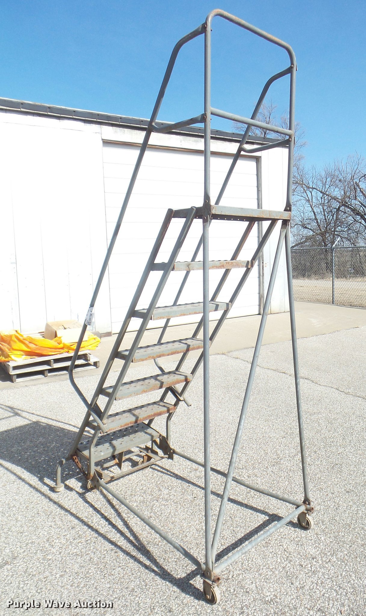 (2) steel ladders in Salina, KS | Item DA7708 sold | Purple Wave