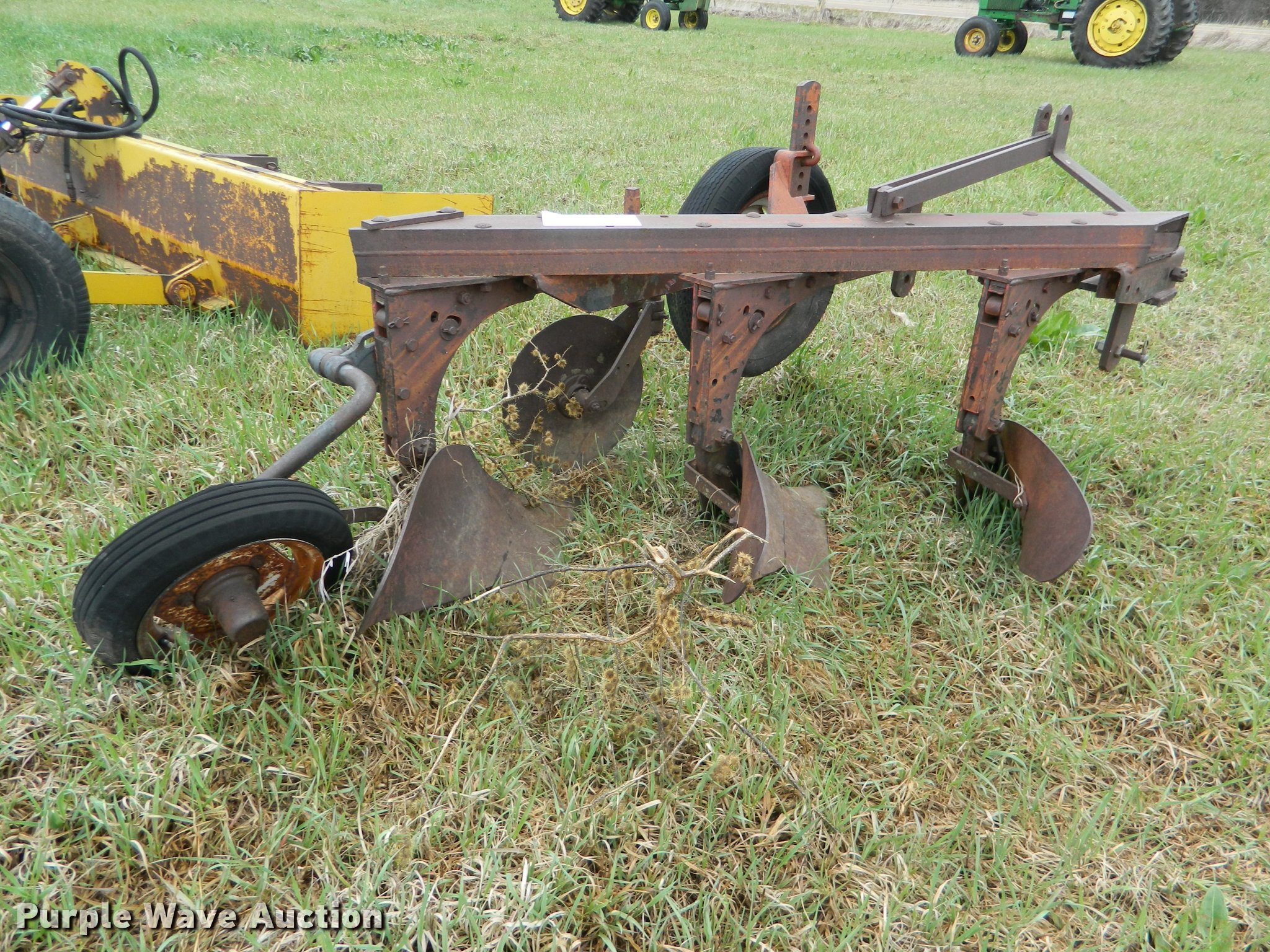 McCormick three bottom plow in Lincoln, KS | Item K2612 sold | Purple Wave