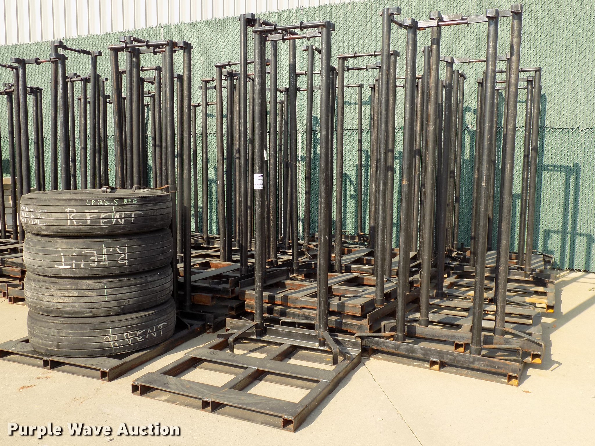 (2) tire racks in Dubuque, IA | Item DC4858 sold | Purple Wave