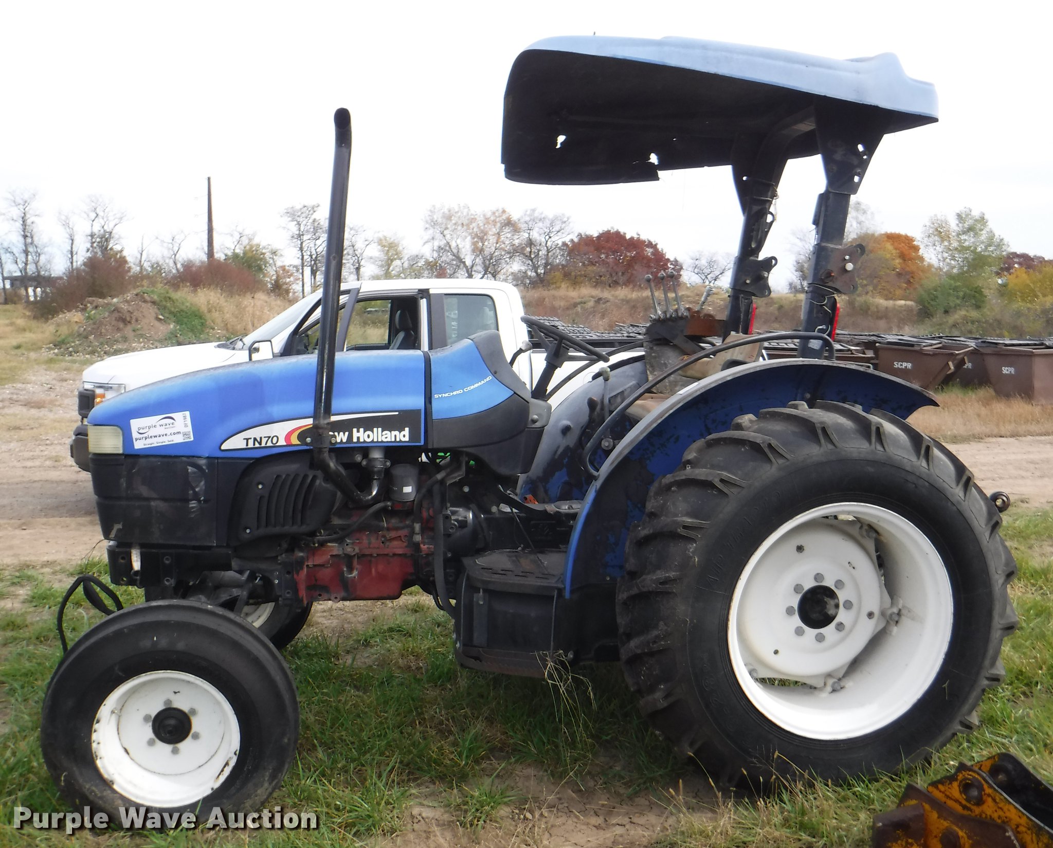 New Holland TN70 tractor in Topeka, KS | Item DF1987 sold | Purple Wave
