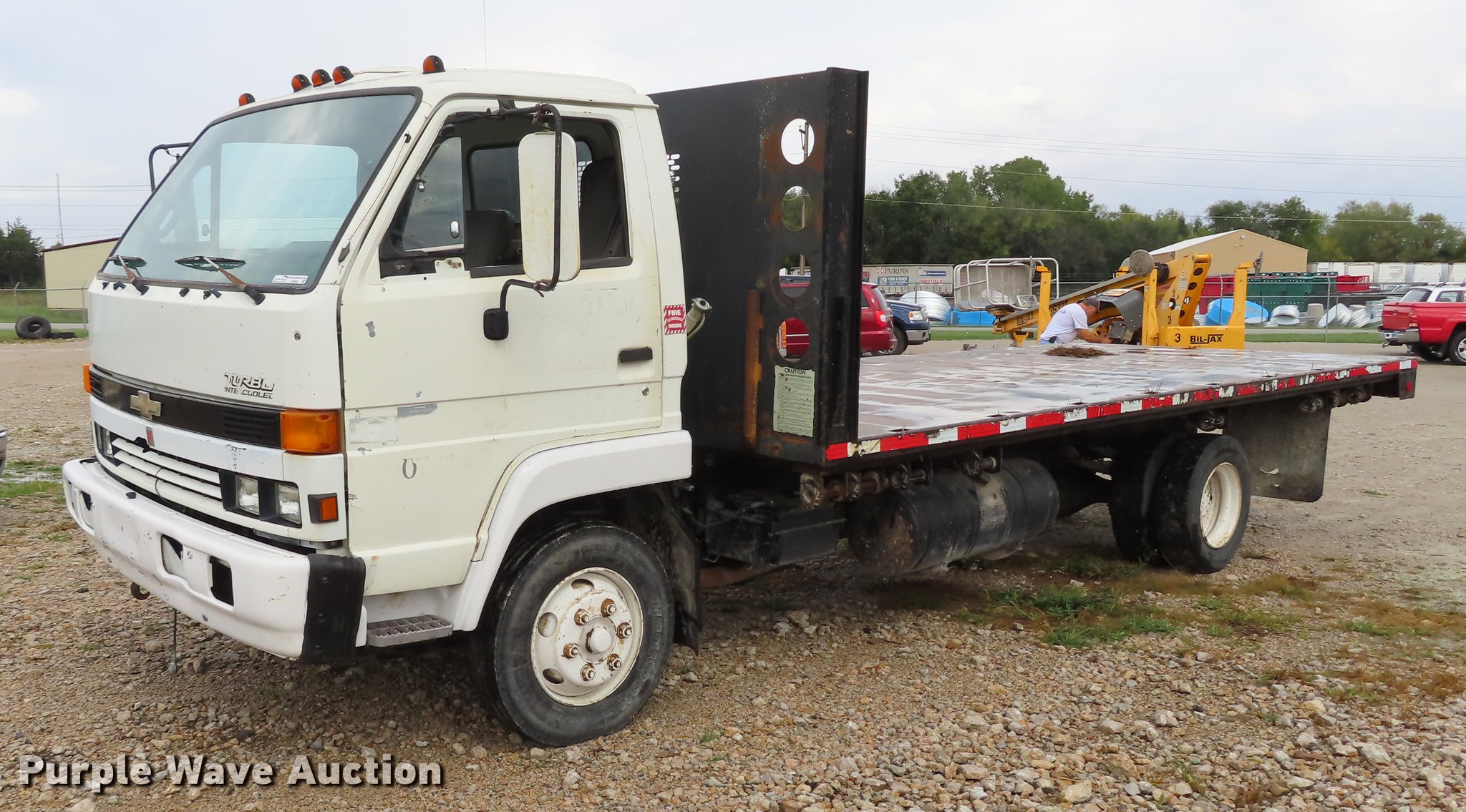 1993 Isuzu NPR dump flatbed truck in Chanute, KS | Item EI9985 sold | Purple Wave