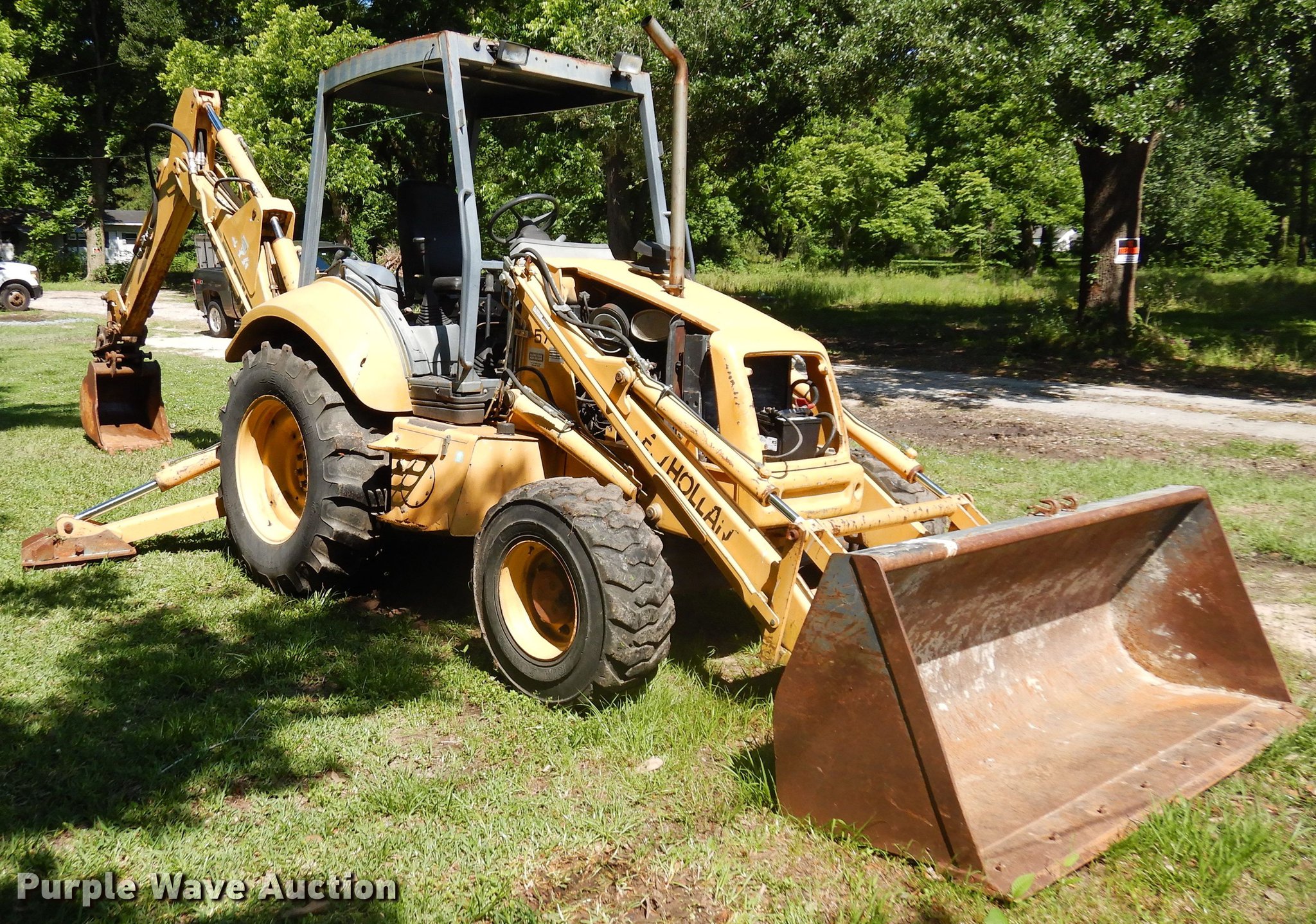 1999 New Holland 575E backhoe in Spring, TX | Item DD3004 sold | Purple ...
